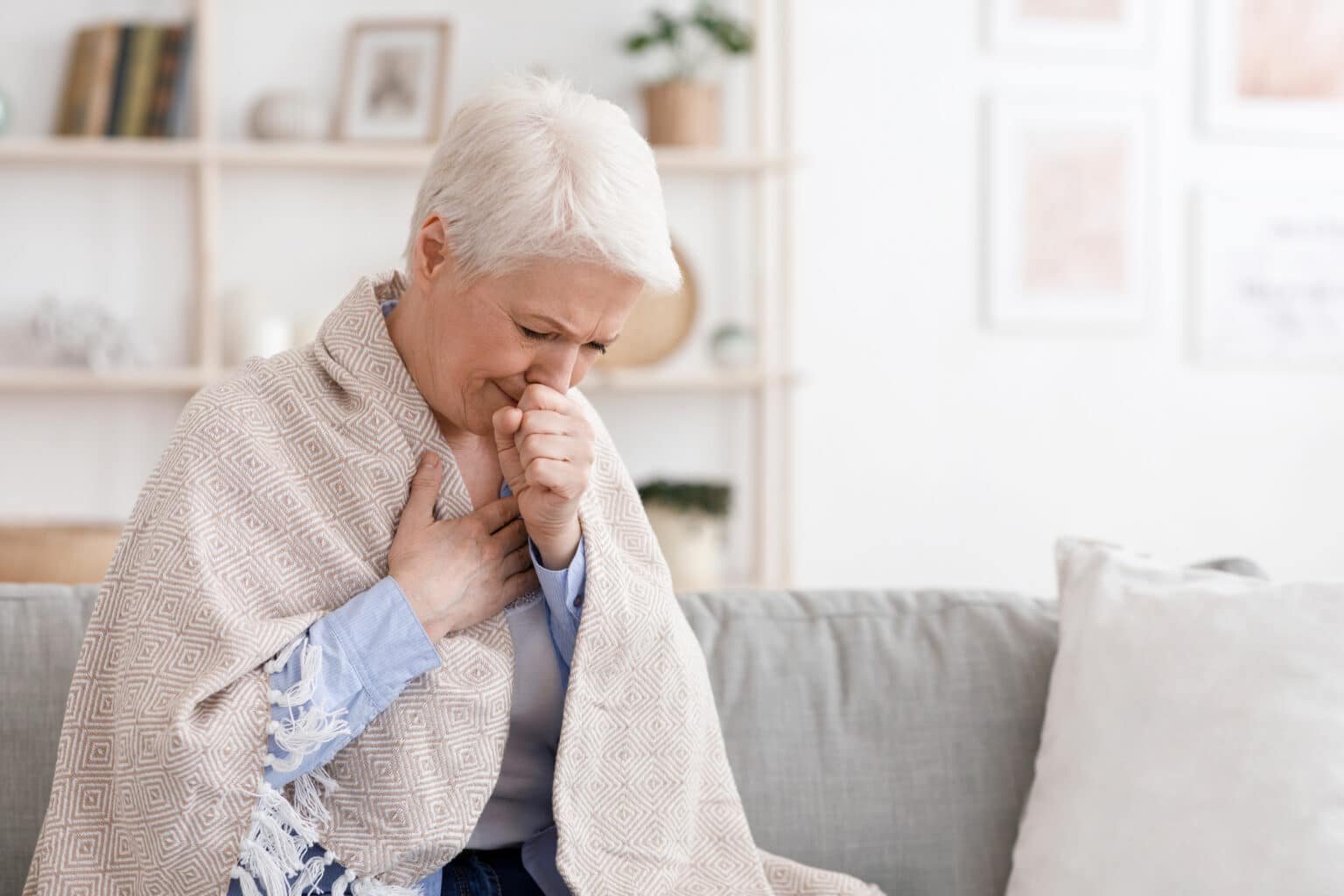 Sick Senior Woman Covered In Blanket Coughing Hard At Home - Better ...